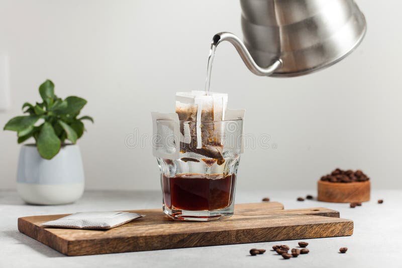 The Process of Brewing Coffee. Water is Poured into a Drip Coffee Bag ...