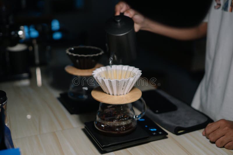 The Process of Brewing and Filtering Coffee Grounds into a Cup To Make ...