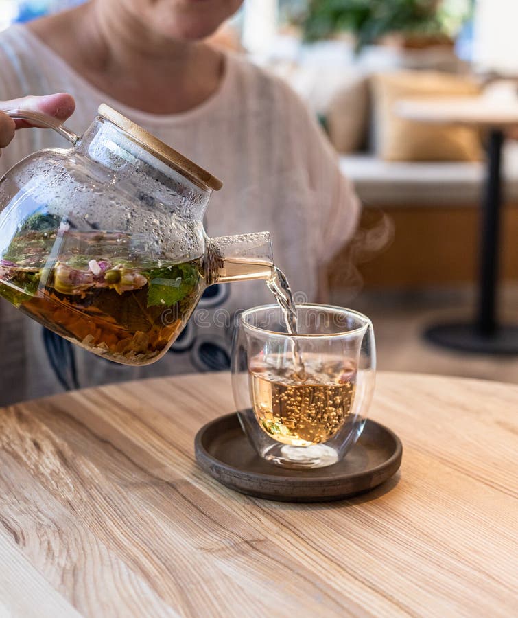 Process Brewing Tea. Hot Herbal or Green Tea with Mint and Rose Petals ...