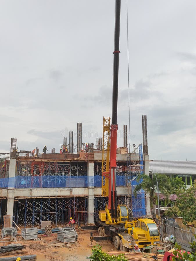 The Process of Building Construction Using a Crane. Editorial Stock ...