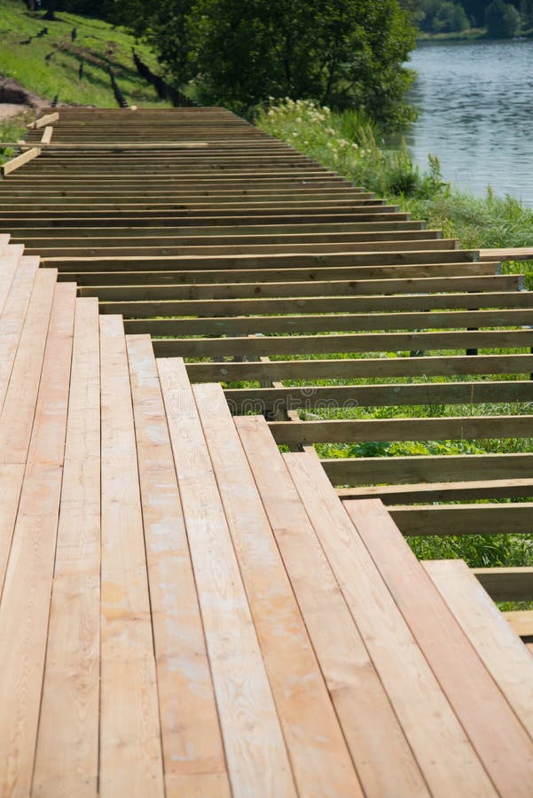 The Process of Building a Wooden Deck by the River. the River, the Work ...