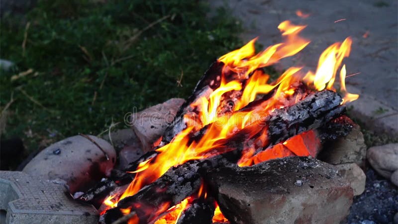 The Process of Burning Fire Along the Edges of the Stone-lined Close-up ...