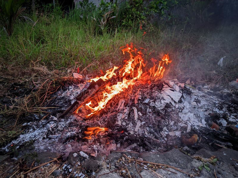 The Process of Burning Garbage with a Blazing Fire. Stock Image - Image ...