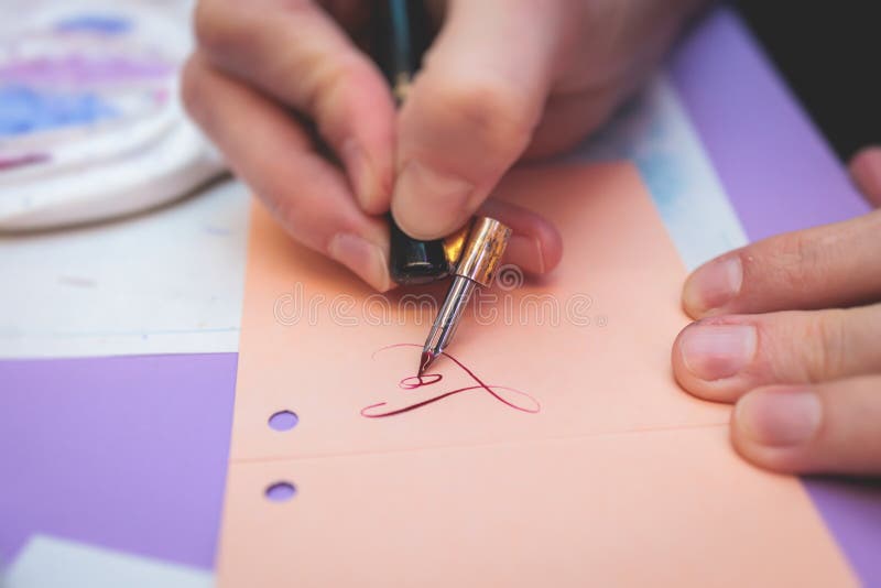 Process of Calligraphy Handwriting with an Ink Fountain Pen Feather ...