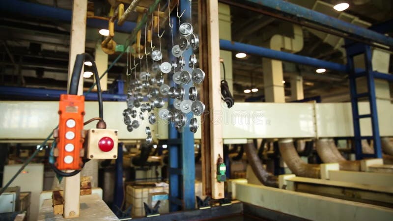 The Process Carefully Involves Handling of Various Hanging Metal Parts ...