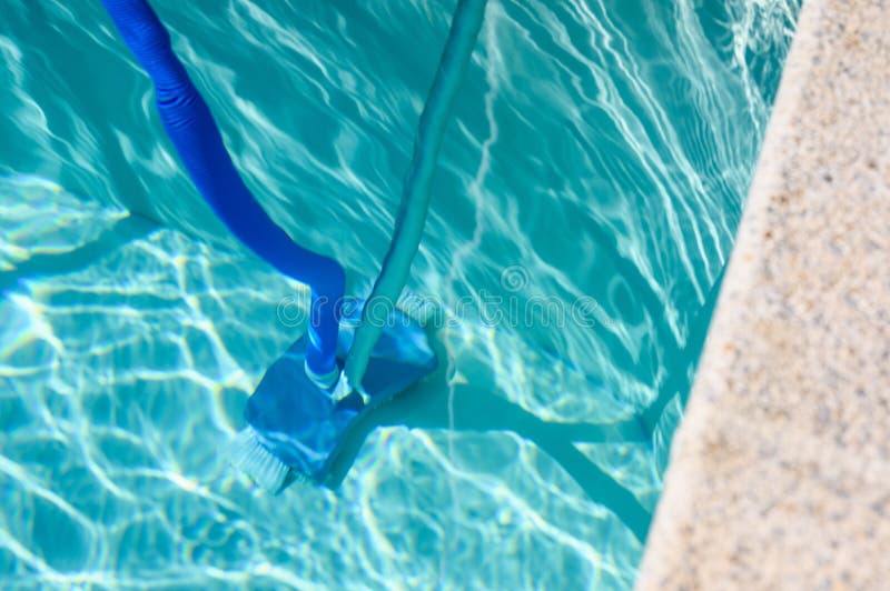 The Process of Cleaning the Bottom of the Pool in the Hotel. Stock ...
