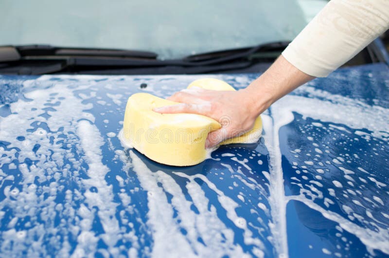 The Process of Cleaning the Hood of the Car with the Help of Shampoo ...