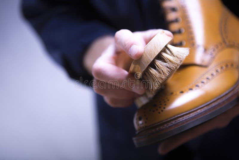 The Process of Cleaning Shoes. a Man is Cleaning His Shoes Stock Image ...