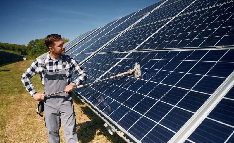 Process of Cleaning the Surface. Engineer with Photovoltaic Solar ...
