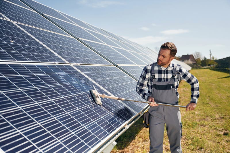 Process of Cleaning the Surface. Engineer with Photovoltaic Solar ...