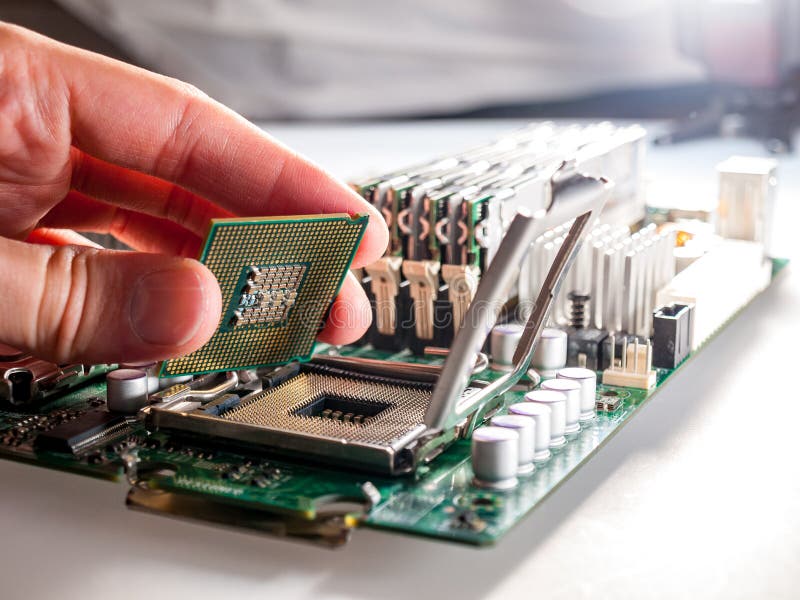 The Process of Connecting the CPU To the Processor Socket on a Modern Computer Motherboard ...