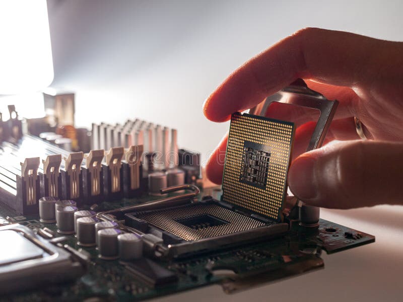 The Process of Connecting the CPU To the Processor Socket on a Modern Computer Motherboard ...