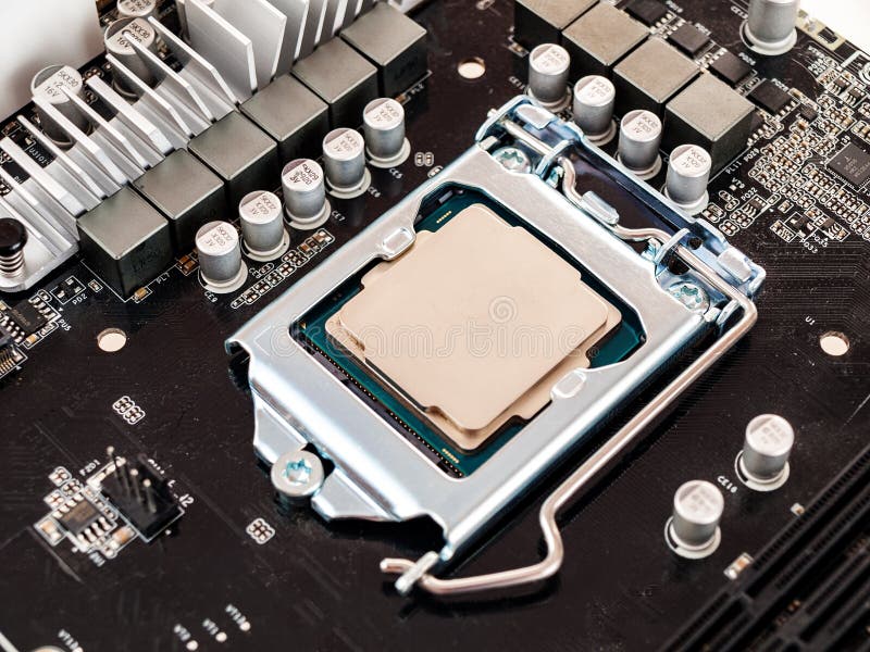 The Process of Connecting the CPU To the Processor Socket on a Modern Computer Motherboard ...