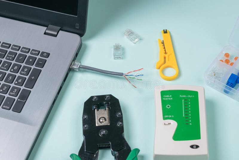 The Process of Connecting an Rj 45 Cable To a Laptop. Stock Image ...