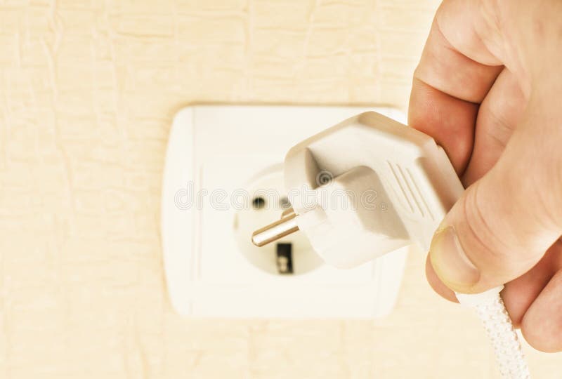 The Process of Connecting the White Plug into the Socket Stock Photo ...