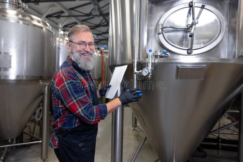 Brewery Worker Checking the Pressure in Tanks with Beer Stock Image ...