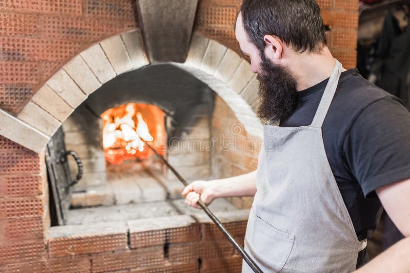 The Process of Cooking Baking Oven in the Countryside Stock Photo ...