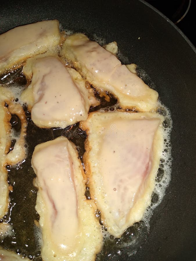 The Process of Cooking Fish in a Frying Pan, Tilapia Fish in Batter ...