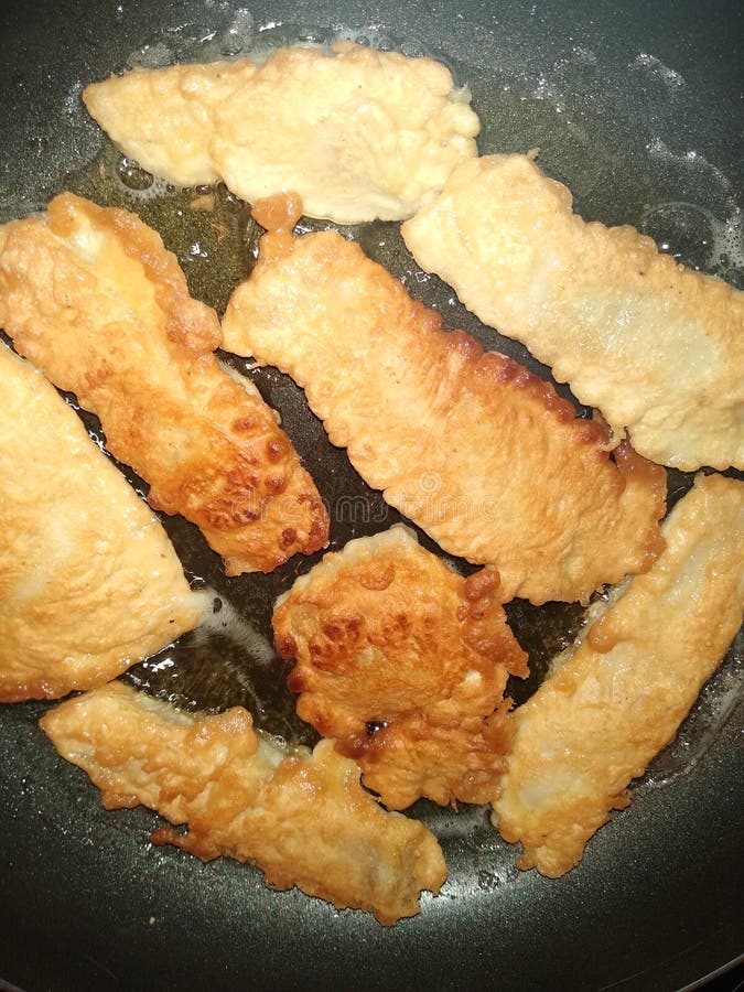 The Process of Cooking Fish in a Frying Pan, Tilapia Fish in Batter ...