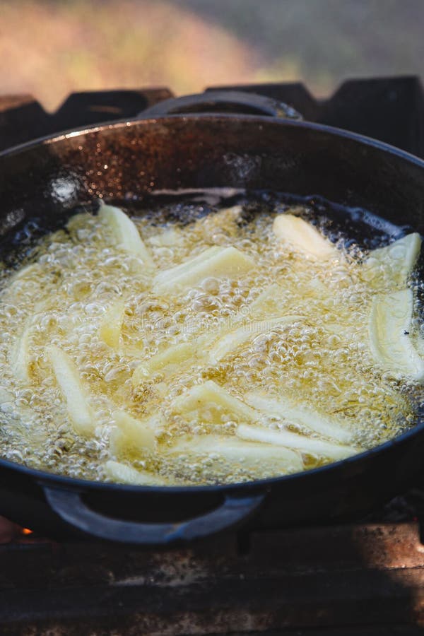 The Process of Cooking French Fries on a Fire in a Cauldron. Time for a ...