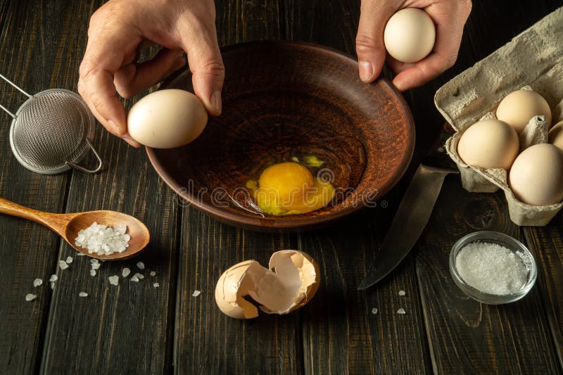 The Process of Cooking or Frying Eggs in the Kitchen. the Cook Prepares ...