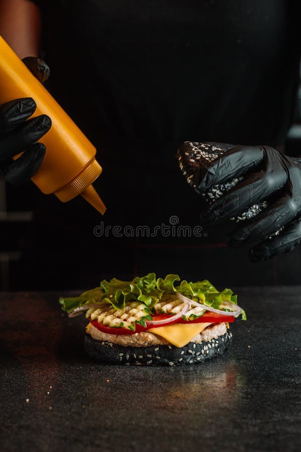 A Closeup of a Hamburger Cooking Process. Chef on Kitchen Table Making ...