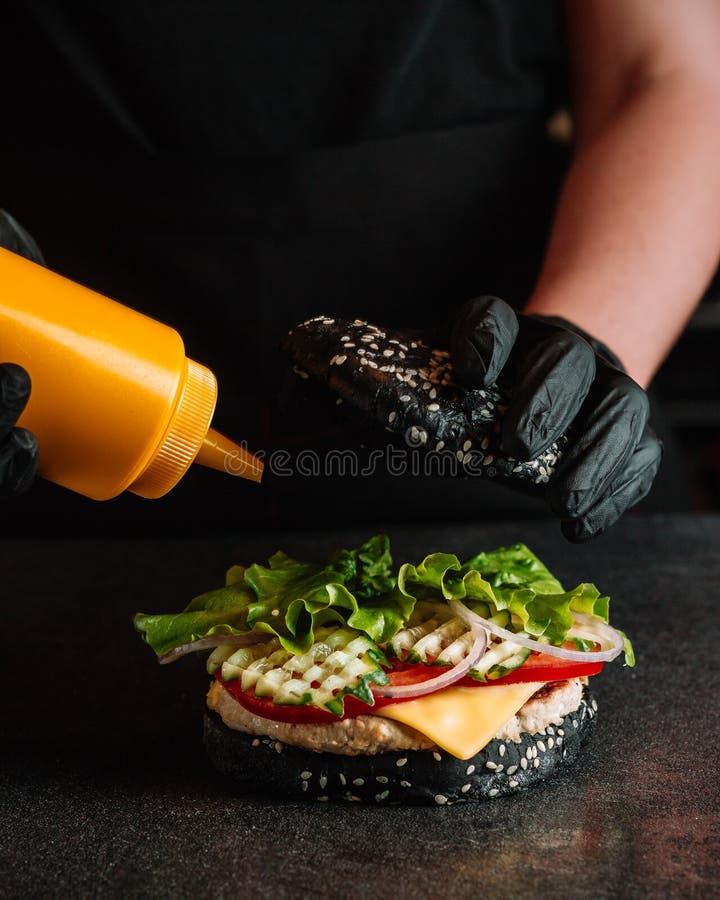 A Closeup of a Hamburger Cooking Process. Chef on Kitchen Table Making ...