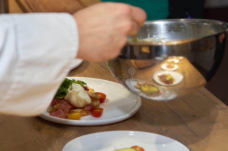 The Process of Cooking: Laying Out the Finished Dish on Plates Stock ...
