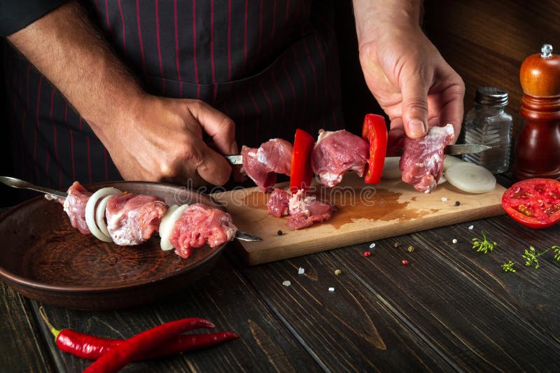 The Process of Cooking Meat Kebab in the Restaurant Kitchen. the Chef ...