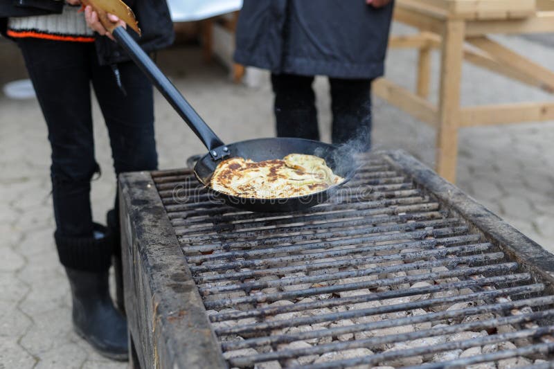 Process of Cooking Pancakes on Frying Pan on Bonfire during Carnival ...
