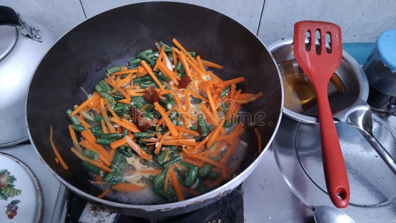 The Process of Cooking Stir-fried Carrots and Long Beans Stock Image ...