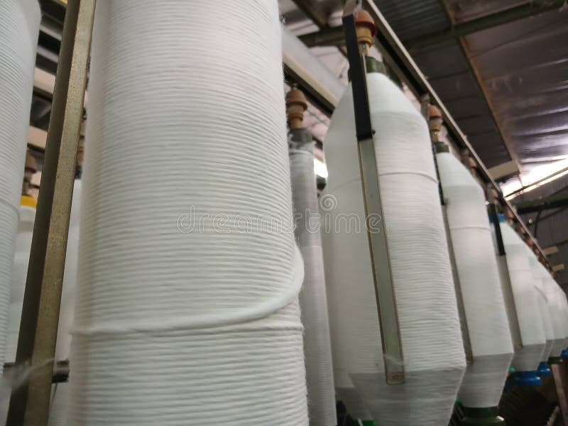 Process of Cotton into Yarn on a Spinning Machine in the Textile Stock ...