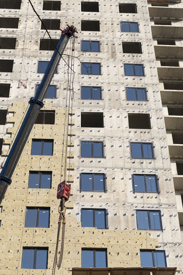The Process of Covering New Building Wall with a Layer of Glass Wool ...