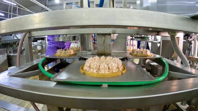 The Process of Creating a Cake on a Conveyor Line. Modern Confectionery ...