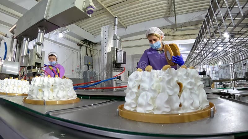 The Final Step in Making the Cake. Completion of the Cake at the ...