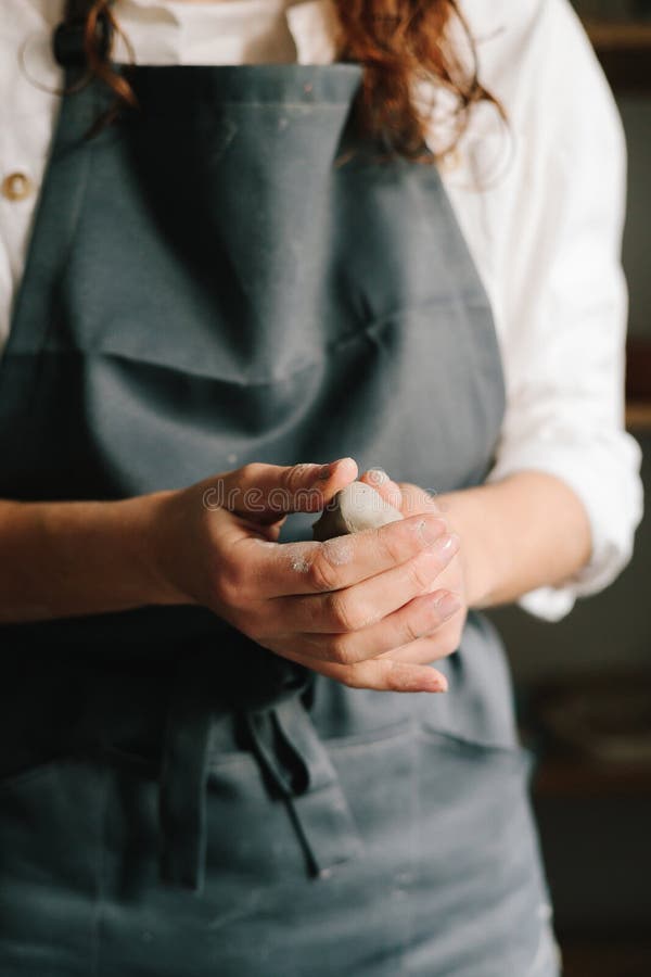 Process of Creating Ceramic Products. Potter Holds a Piece of Wet Clay ...