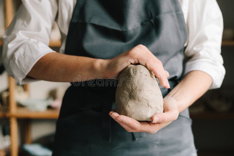 Process of Creating Ceramic Products. Potter Holds a Piece of Wet Clay ...