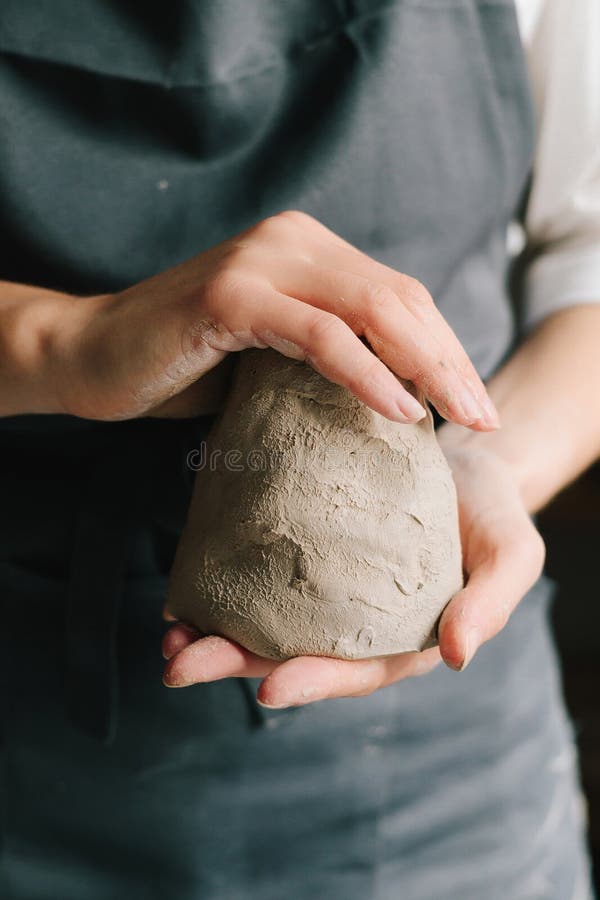 Process of Creating Ceramic Products. Potter Holds a Piece of Wet Clay ...