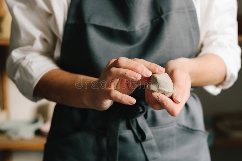 Process of Creating Ceramic Products. Potter Holds a Piece of Wet Clay ...