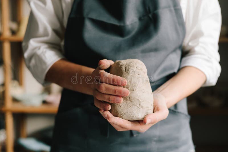 Process of Creating Ceramic Products. Potter Holds a Piece of Wet Clay ...