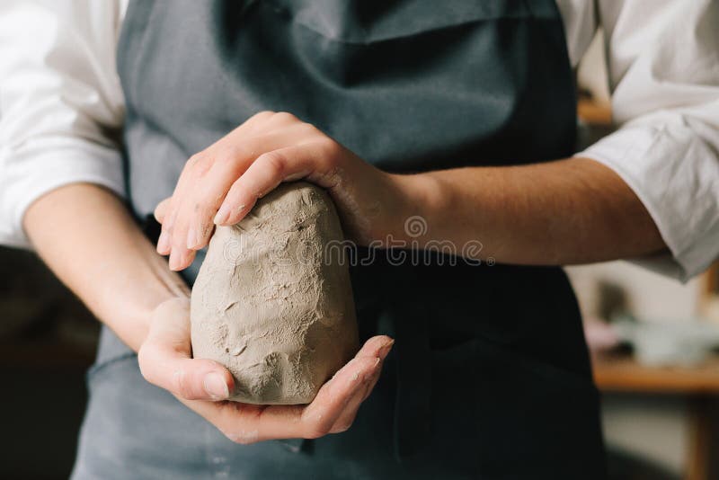 Process of Creating Ceramic Products. Potter Holds a Piece of Wet Clay ...