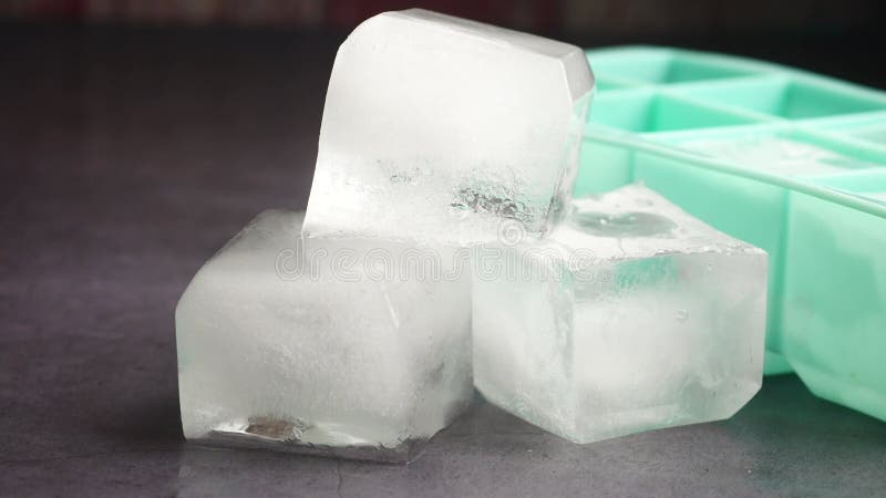 Making Clear Ice Cubes for Refreshing Drinks at Home Stock Video ...
