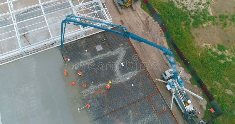 The Process of Creating a Concrete Floor. Pouring the Formwork with ...