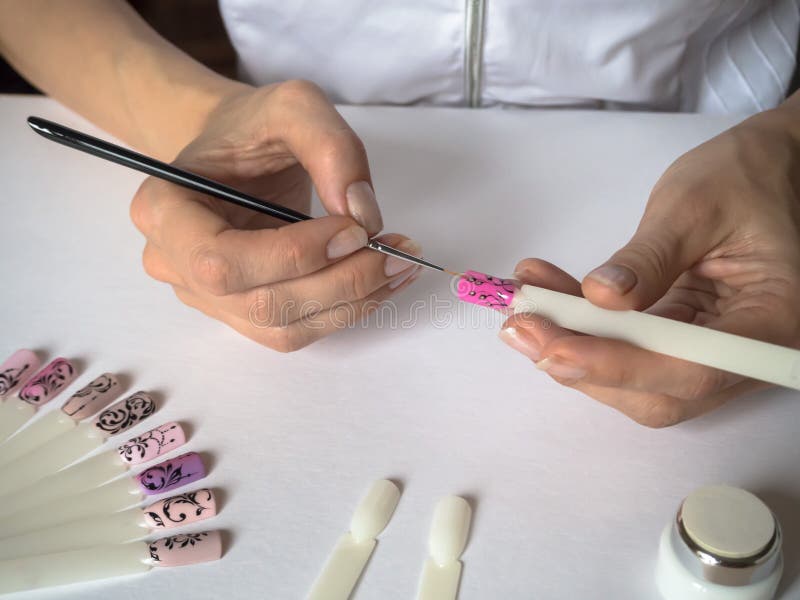 The Process of Creating a Drawing on Tips. Nail Art Design. Stock Photo ...