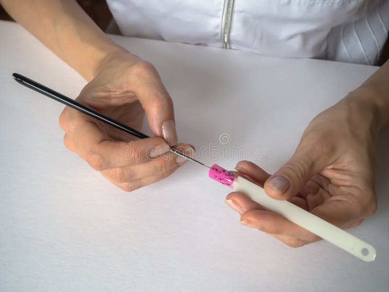 The Process of Creating a Drawing on Tips. Nail Art Design. Stock Photo ...