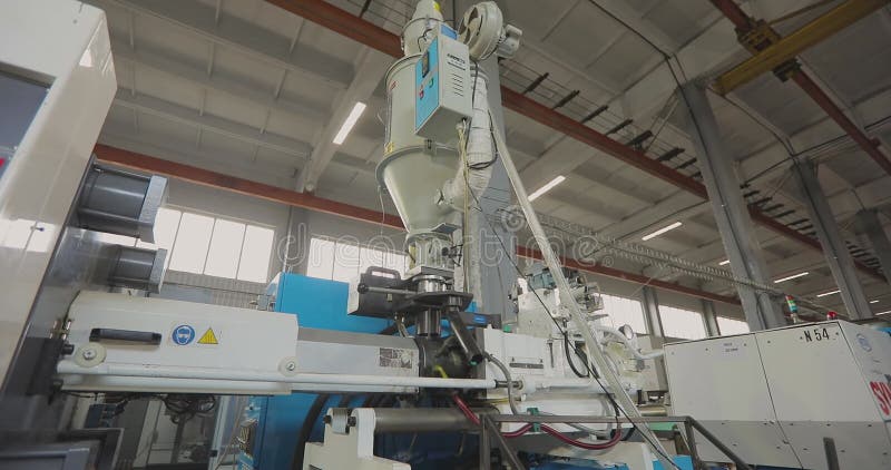 Injection Molding Thermoplastic Machine. the Process of Creating a ...
