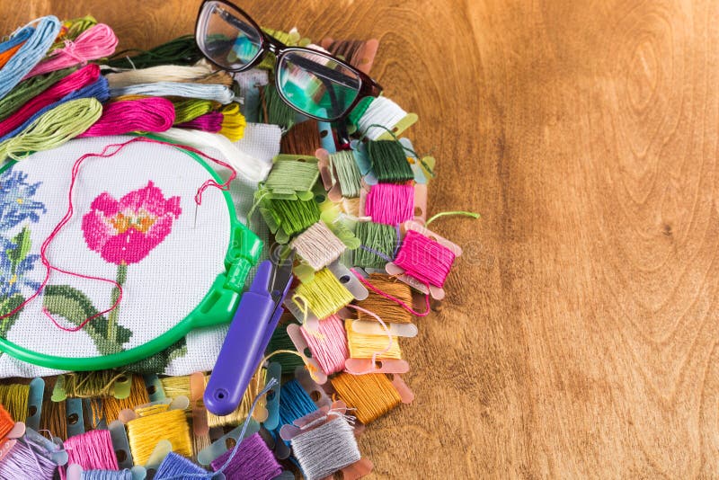 The Process of Cross-stitch. Canvas on Hoops, Needles, Embroidery Floss ...