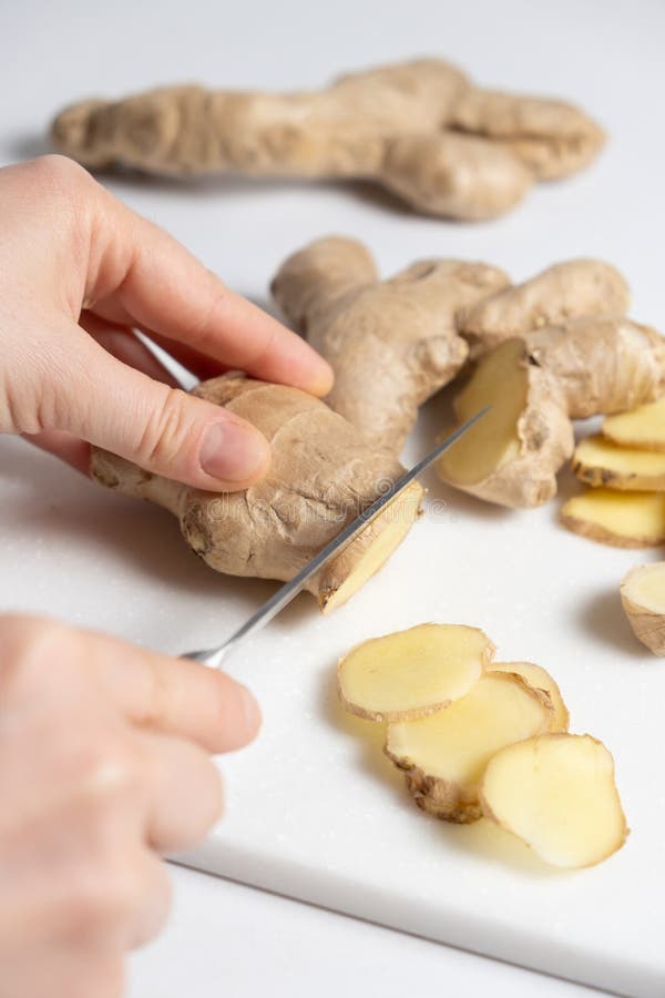 The Process of Cutting Ginger Root with a Knife Stock Image - Image of ...