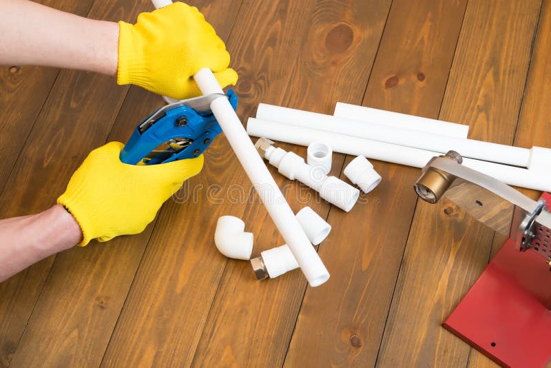 The Process of Cutting Plastic Pipes for Water Supply, Top View Stock ...