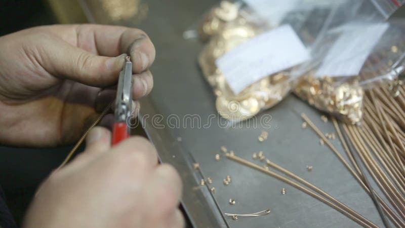 Process of Cutting Spiral Gold Wire into Small Stock Video - Video of ...
